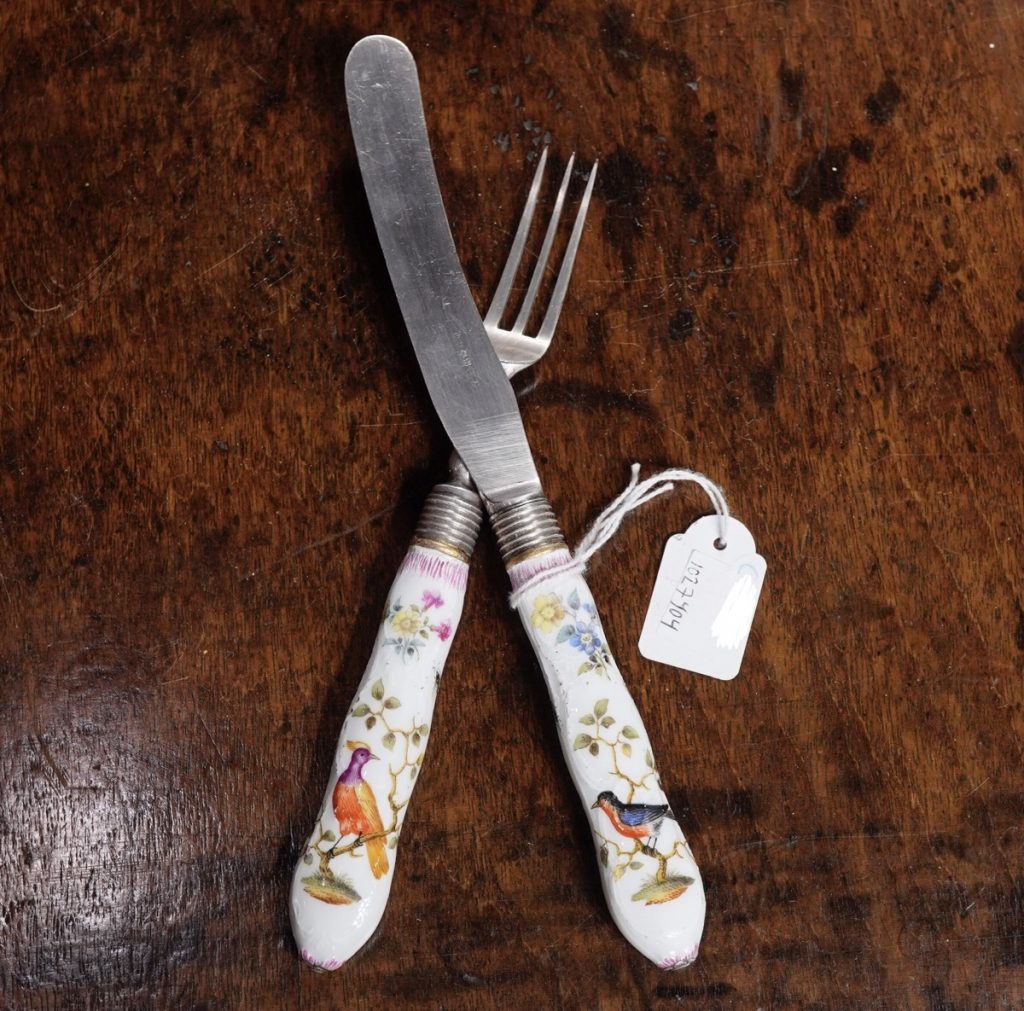 Pair of porcelain handles painted with birds, knife/fork, German c ...